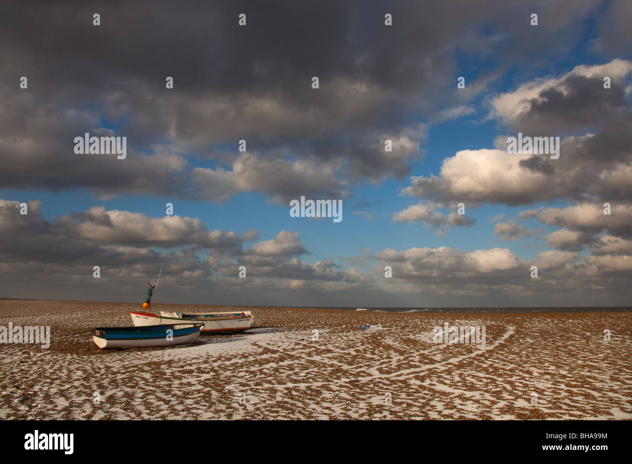 Winter snow fall and crab boats on Cley Beach in Winter north Norfolk ...