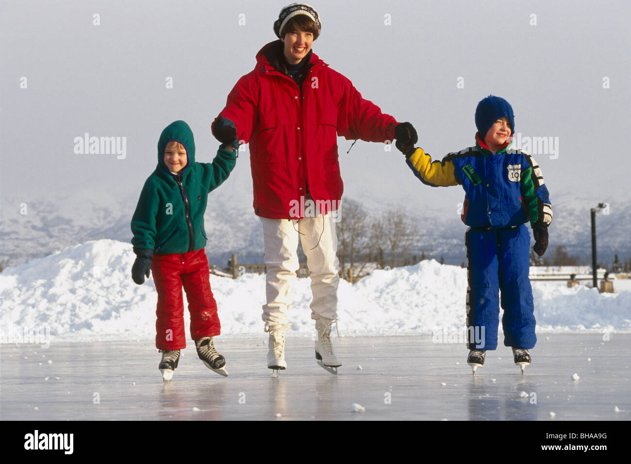 Family ice skating rink Mother and sons Anchorage AK Southcentral ...