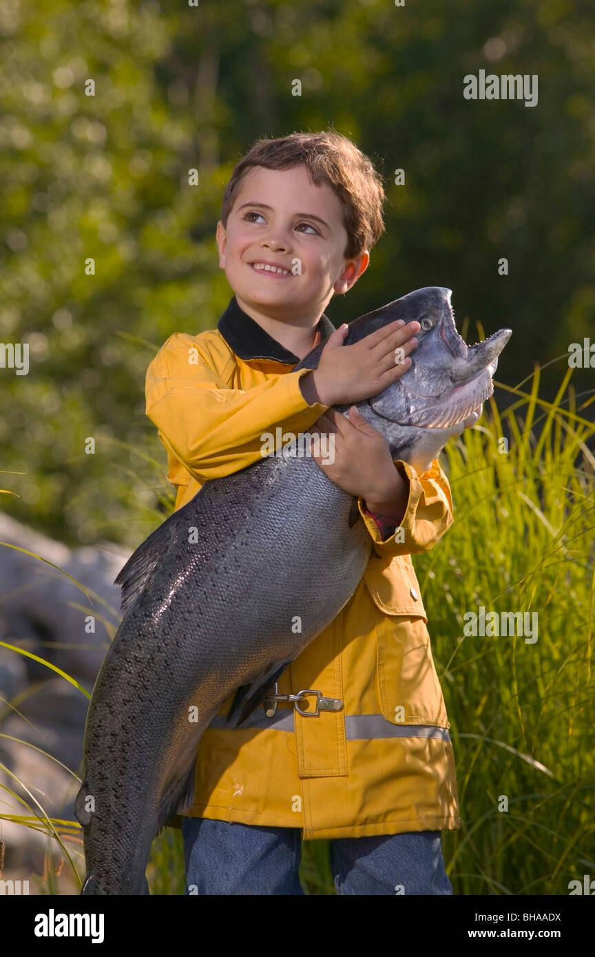 Boy holding big fish hi-res stock photography and images - Alamy