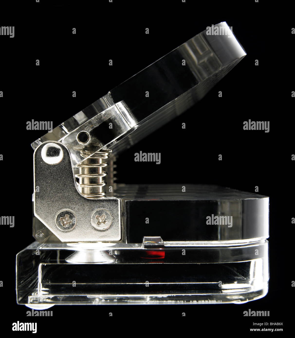 clear hole punch stationary office paper black Stock Photo - Alamy