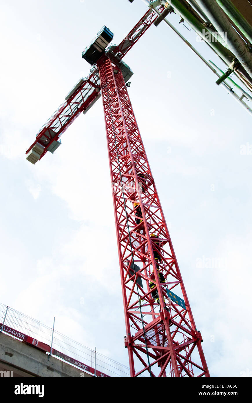 firemen climbing a tower crane Stock Photo - Alamy
