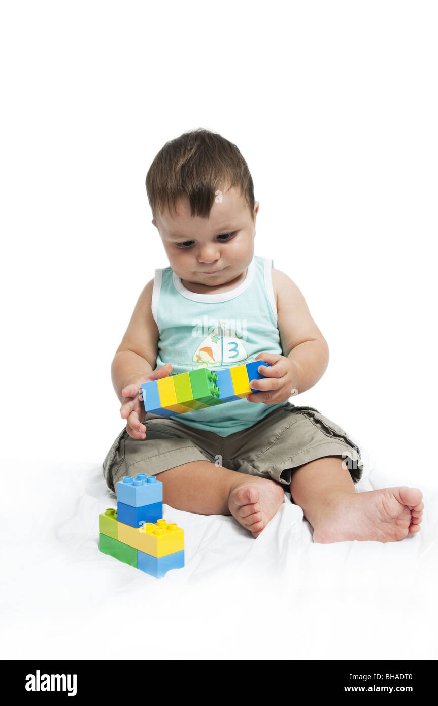 Baby boy playing with building blocks Stock Photo - Alamy