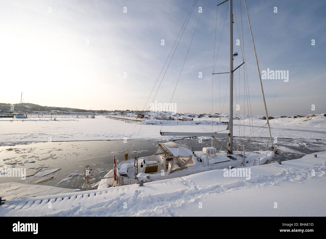 sailing boat in winter sea ice, Sweden Stock Photo - Alamy