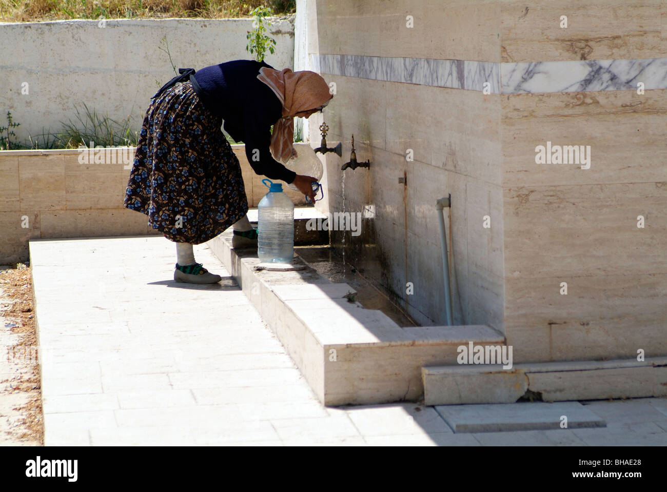 turkish village women collecting drinking water from communal village ...