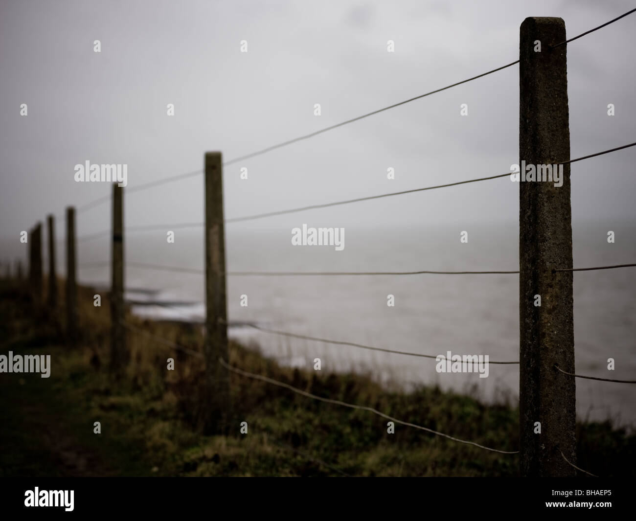 Cliff edge border danger drop wire sea hi-res stock photography and ...