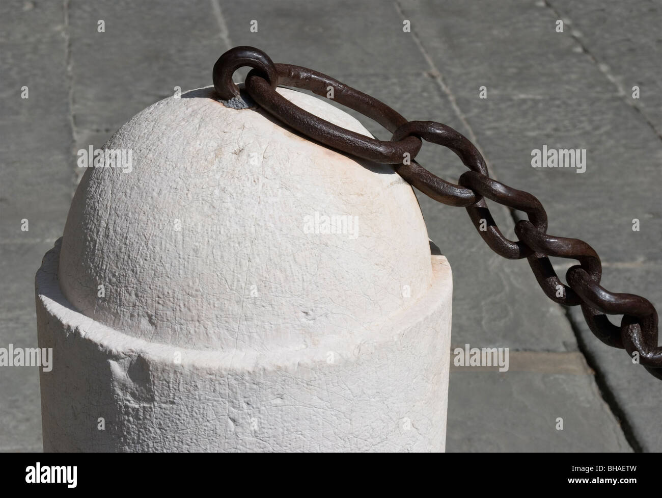 chain on ancient stone bollard Stock Photo - Alamy