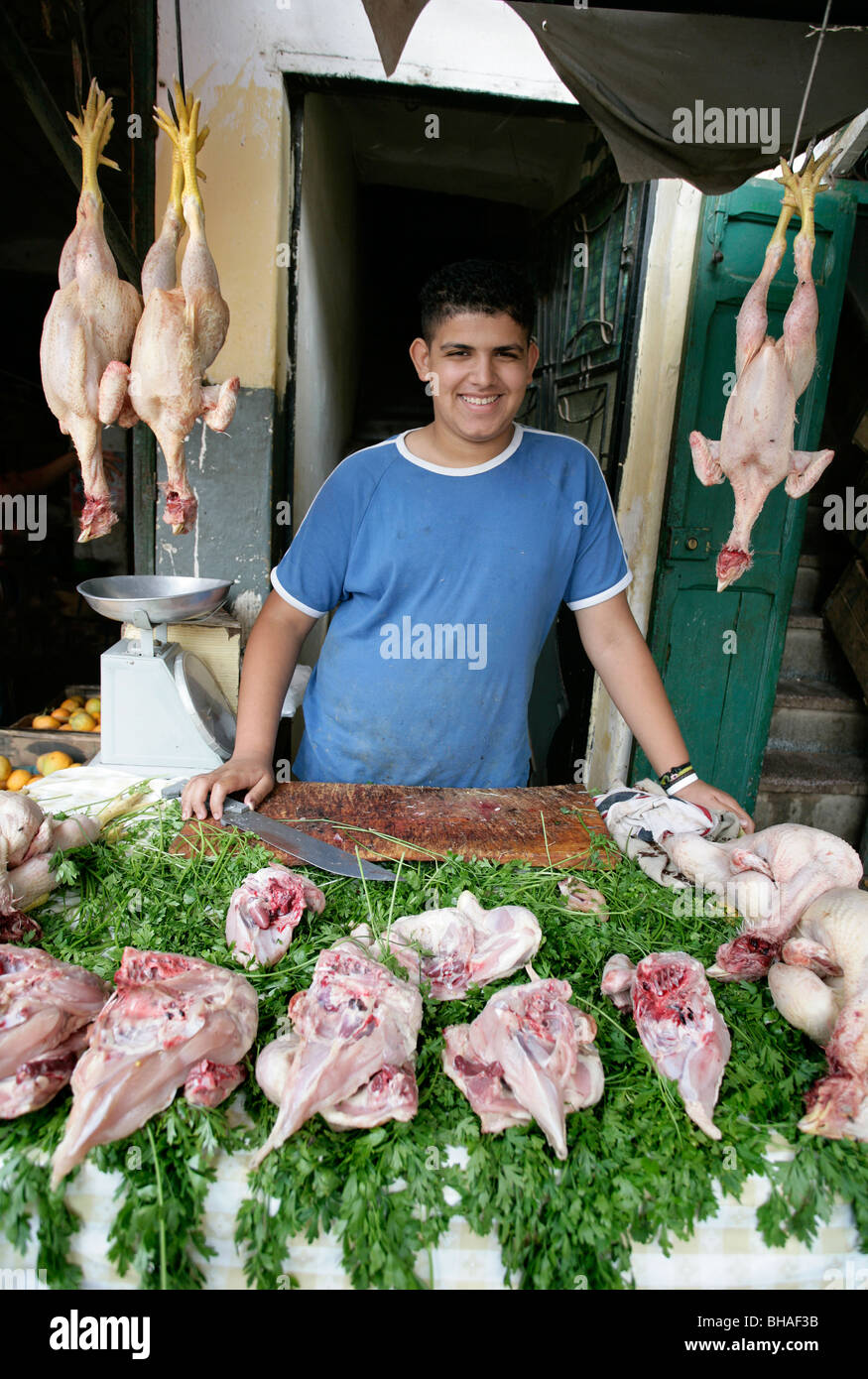 Chickens and chicken parts for sale at a meat stall along one of the ...