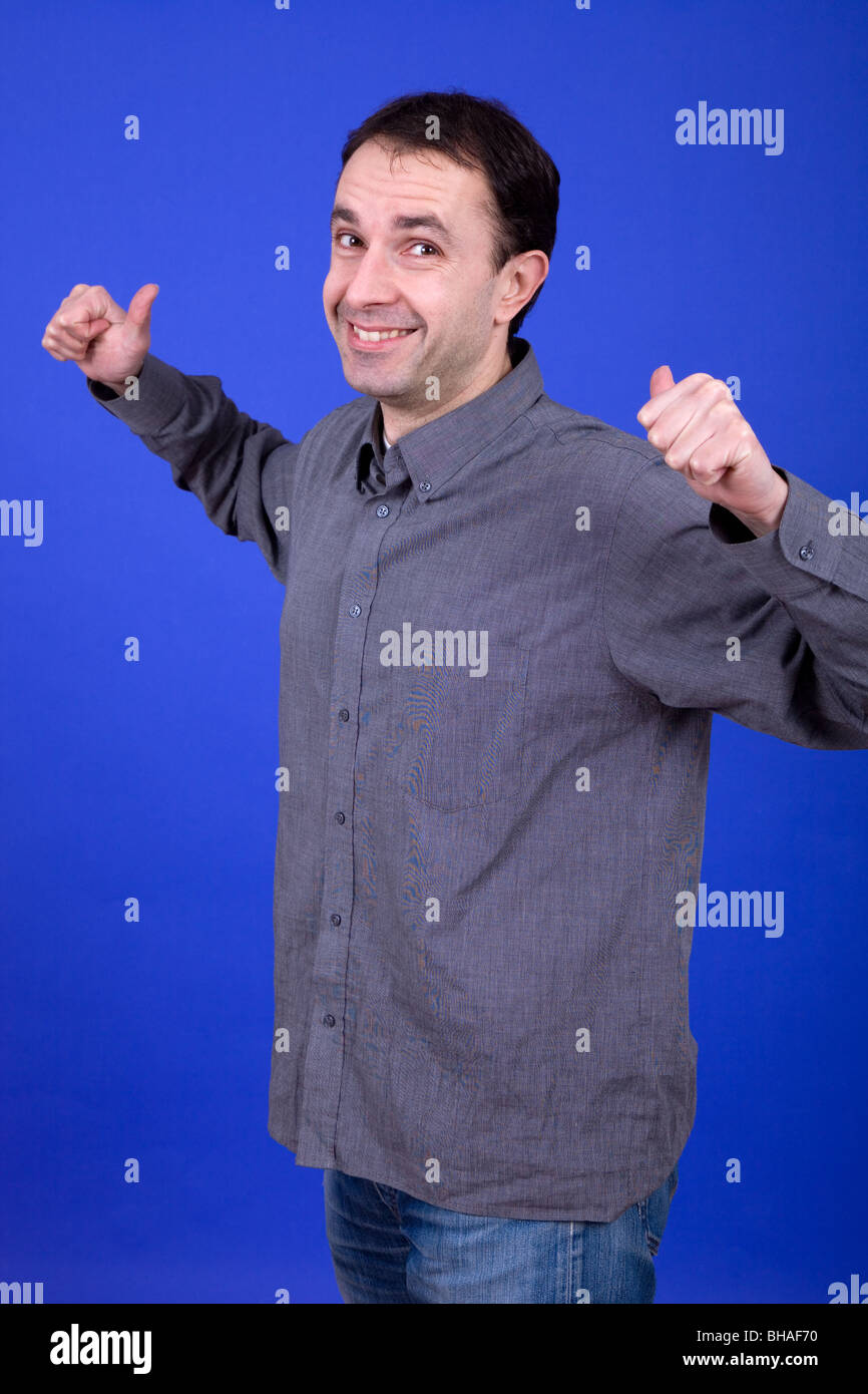 an young man portrait over a blue background Stock Photo - Alamy