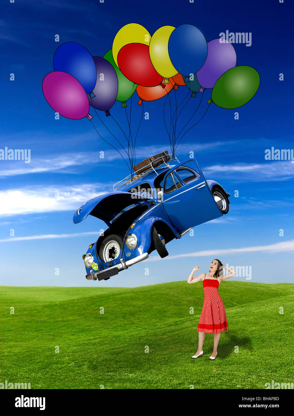 Woman waiting for a beetle car falling from the sky with balloons Stock ...