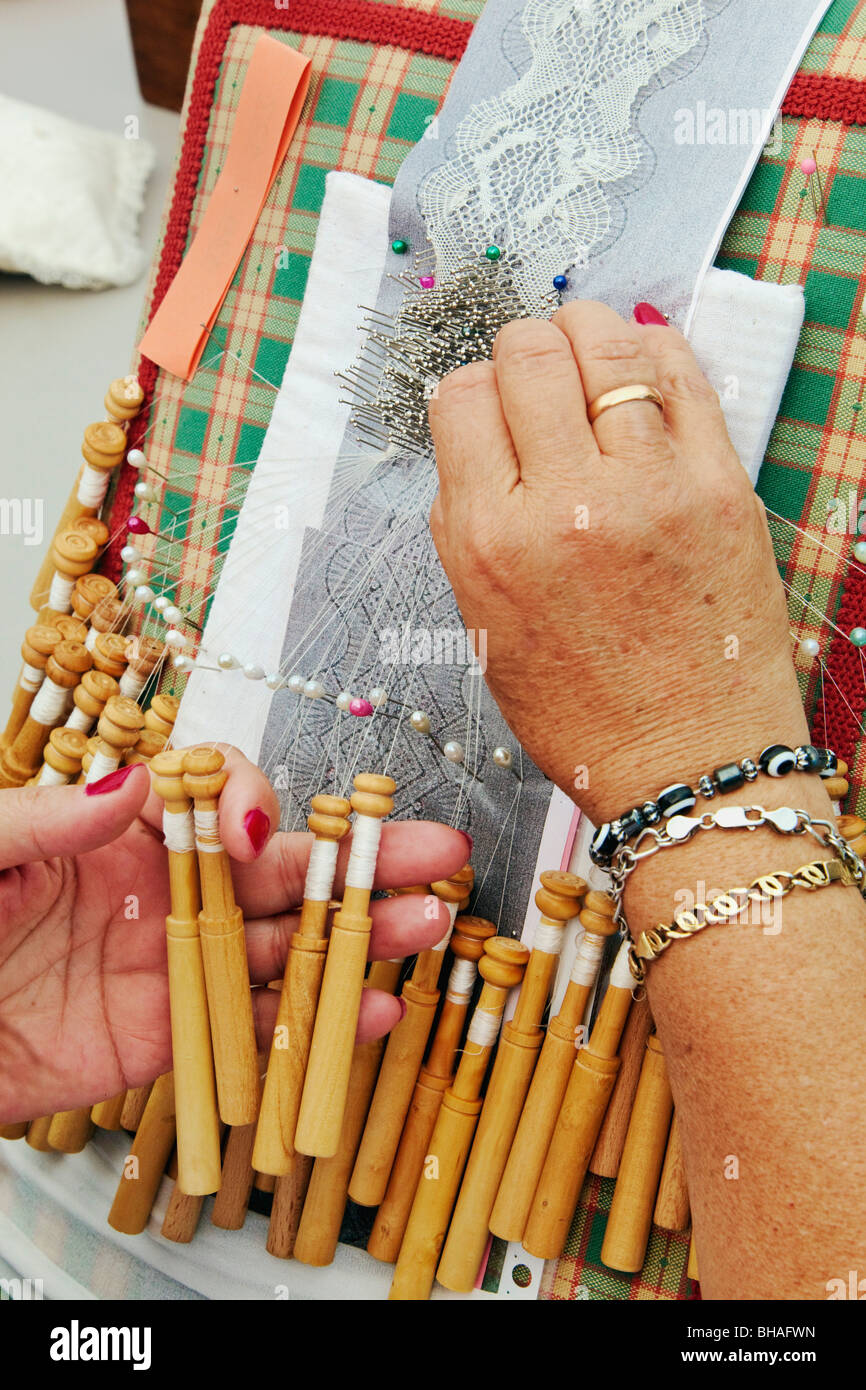 Woman doing traditional lace-making Stock Photo - Alamy