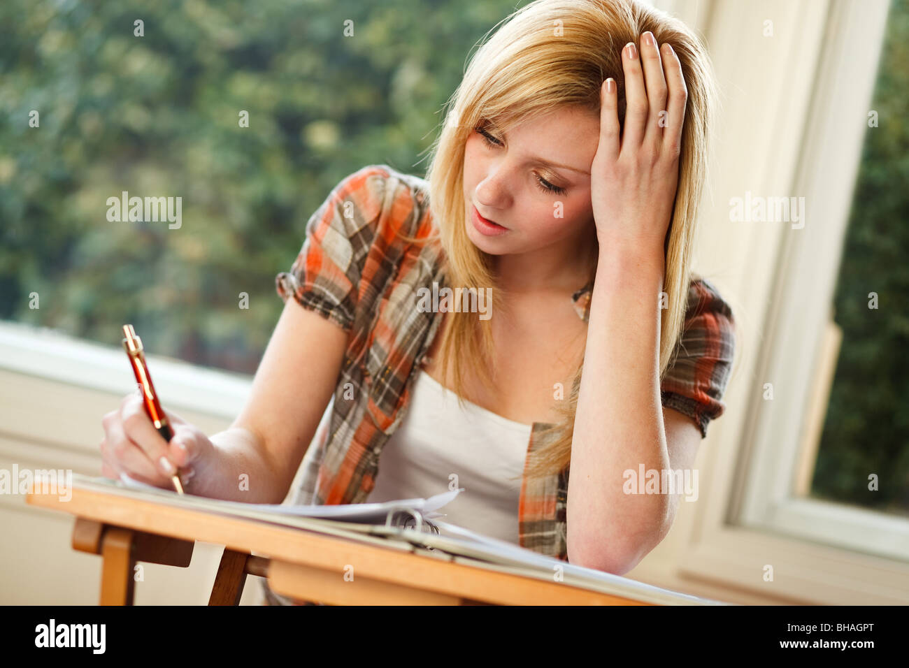 Student girl sat on the floor studying hi-res stock photography and ...
