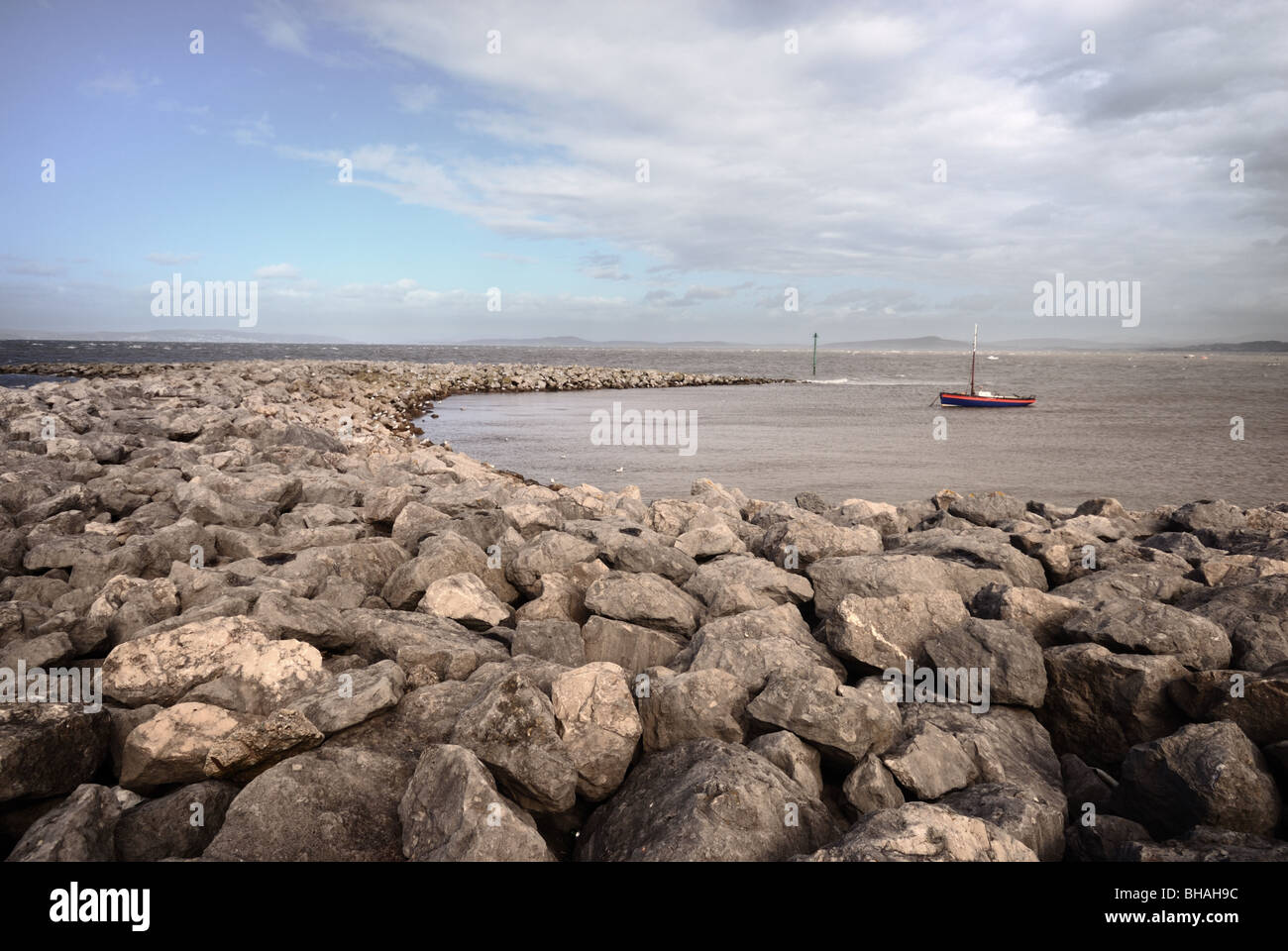 Huge boulders placed as coastal sea defenses protecting the shoreline ...