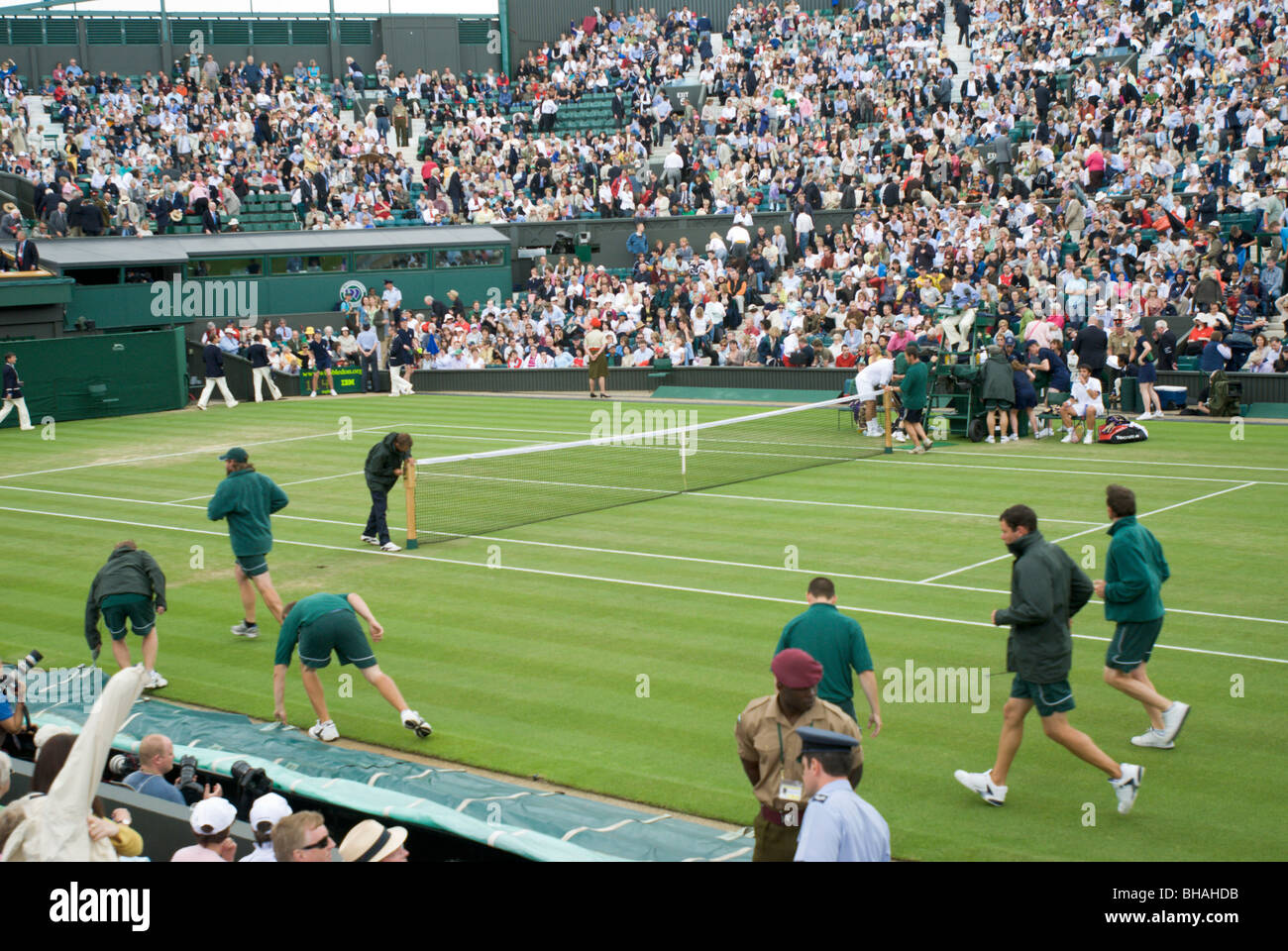 Centre court covers are deployed to cover the playing surface ...