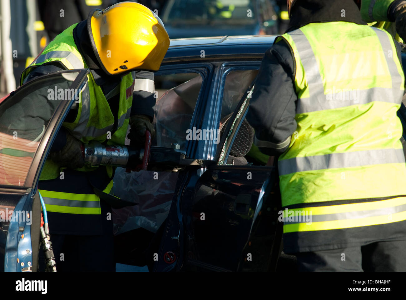 Firemen practicing RTC extrication procedures Stock Photo - Alamy
