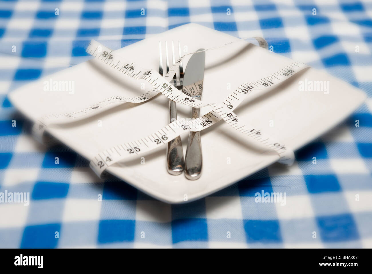 Empty plate with measure tape hi-res stock photography and images - Alamy