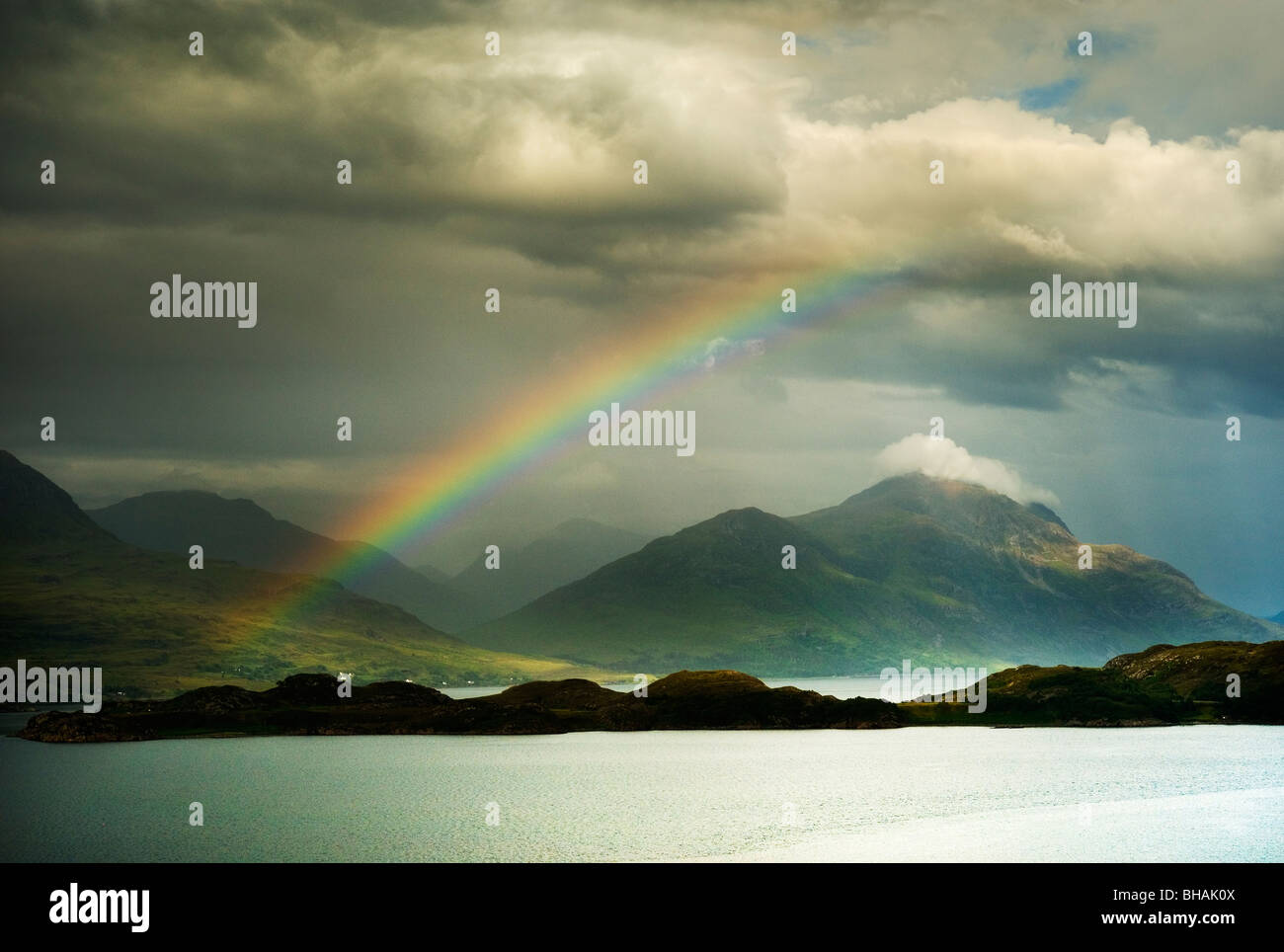 Rainbow in dramatic highland light, Scotland Stock Photo - Alamy
