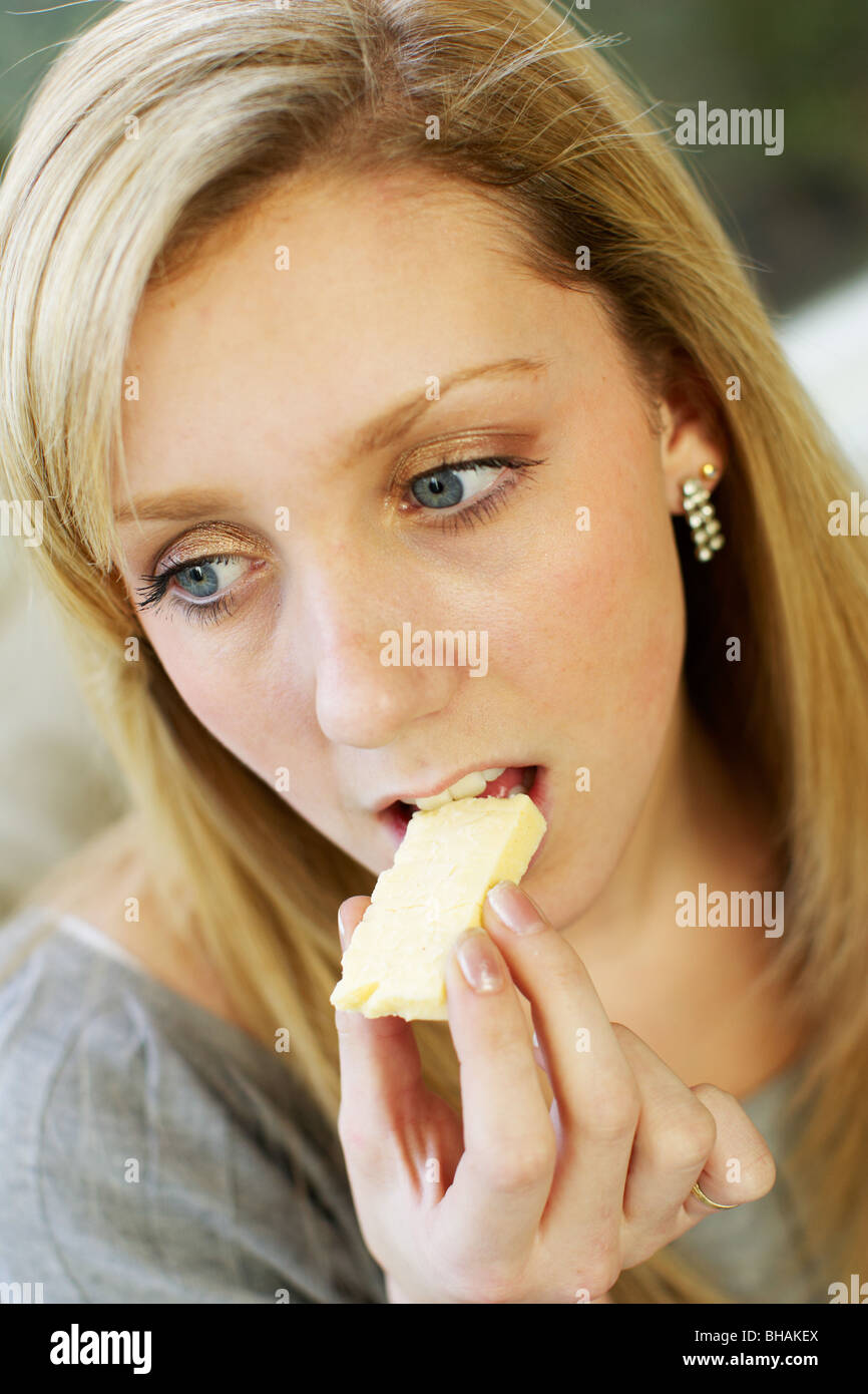 Girl eating cheese Stock Photo - Alamy