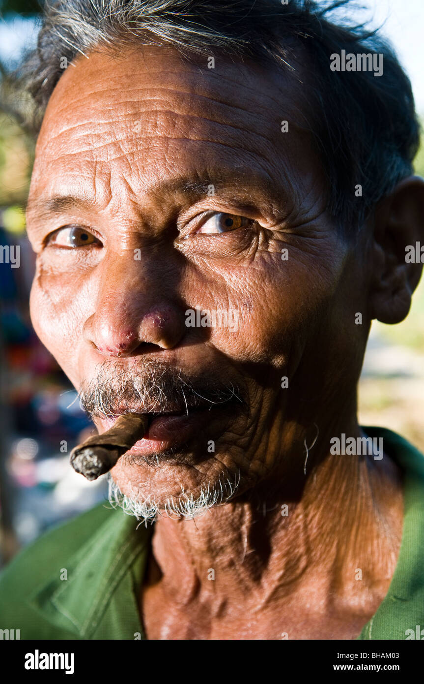 Enjoying smoking his big rolled cigarette Stock Photo - Alamy
