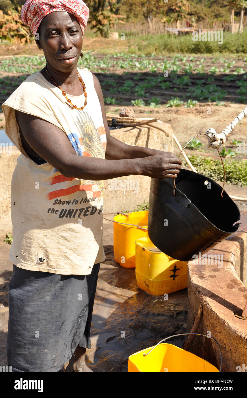 Woman fetching water hi-res stock photography and images - Alamy
