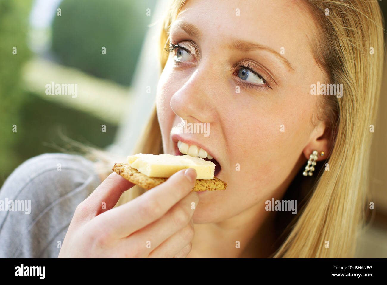 Girl eating cheese Stock Photo - Alamy