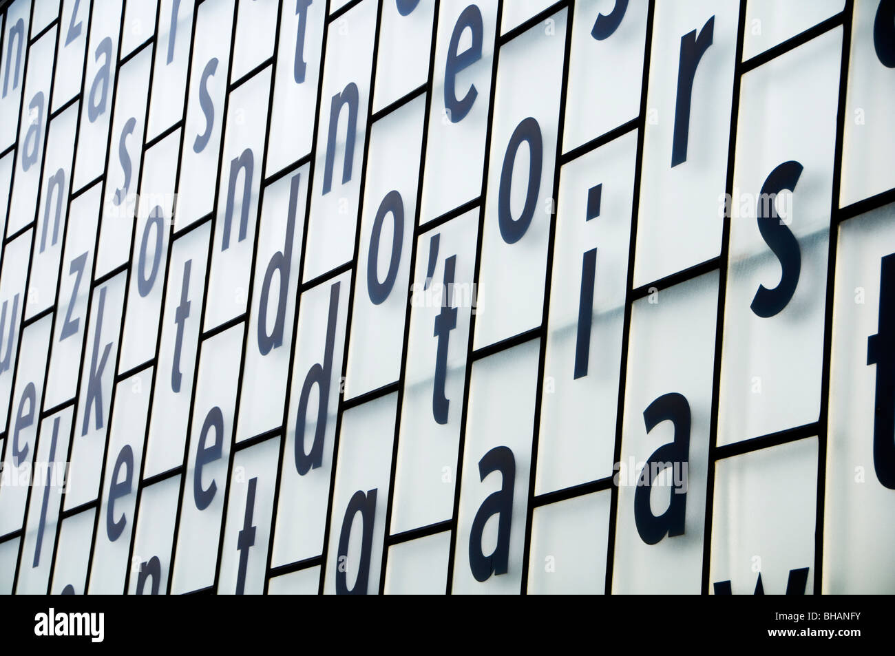 Letters of the alphabet on the side of a building occupied by a ...