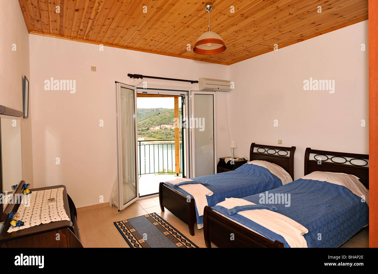 Twin bedded bedroom of a luxury holiday vacation villa Stock Photo - Alamy