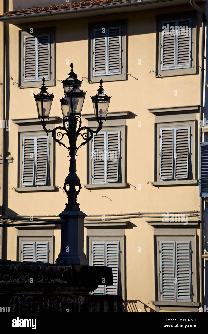 Shuttered windows on a typical Italian building, with the silhouette of ...