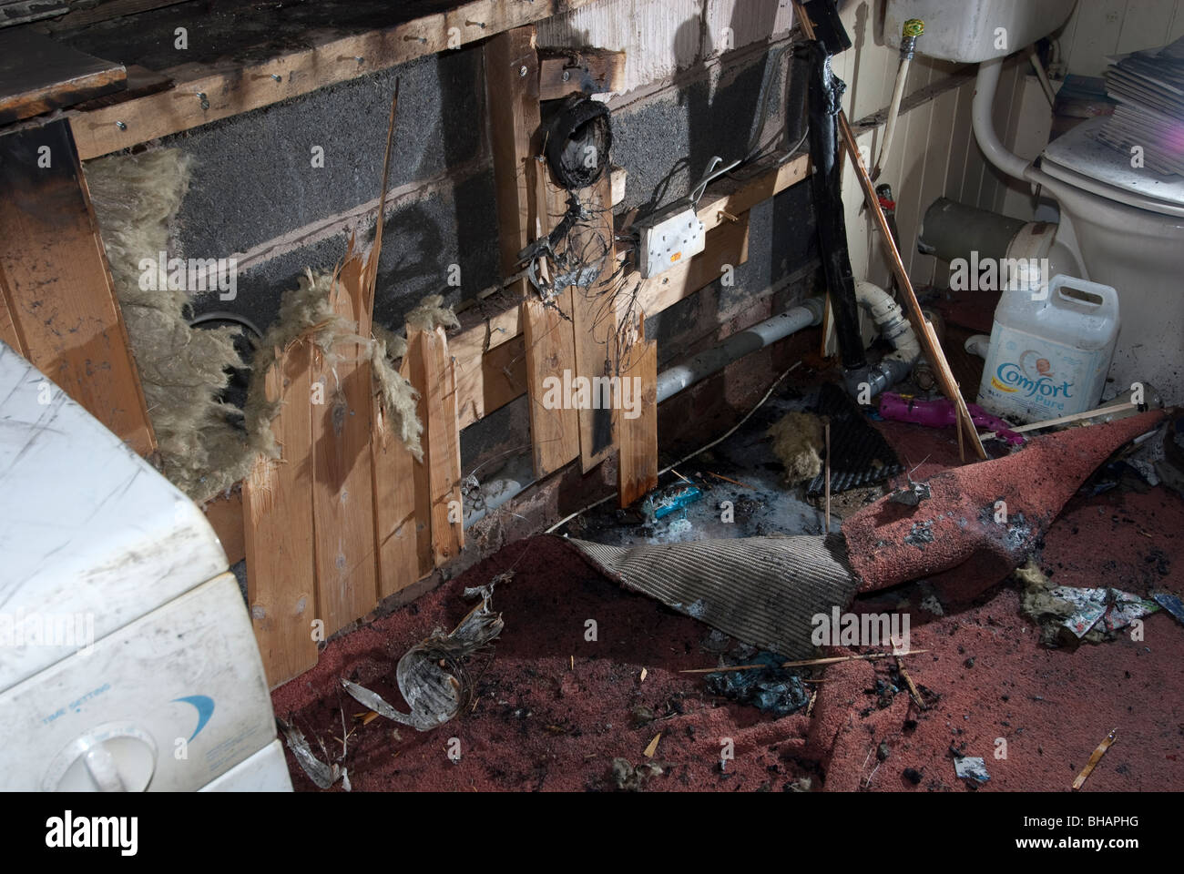 Burnt wall from washing machine fire in utility room Stock Photo - Alamy