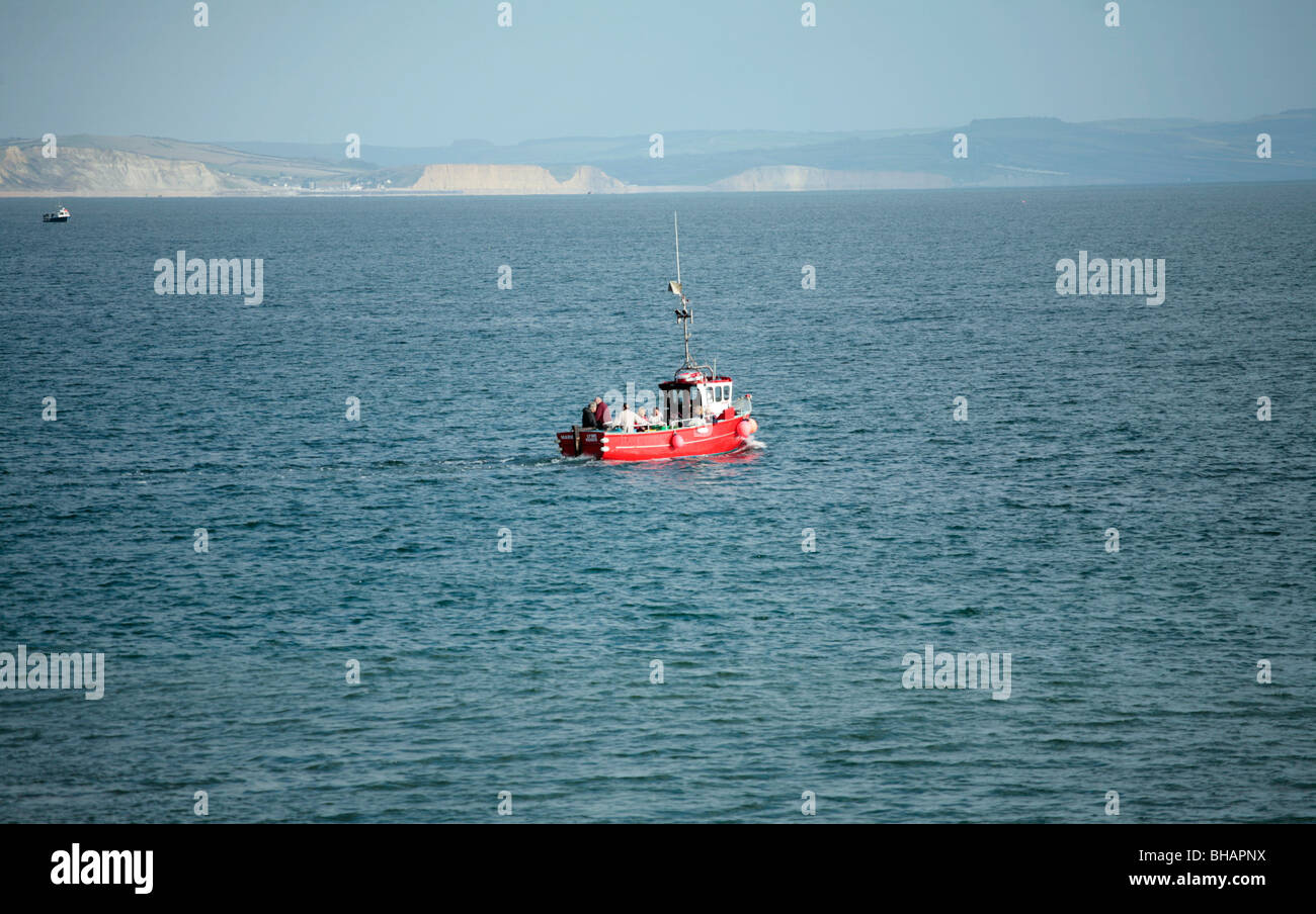 Red fishing boat hi-res stock photography and images - Alamy