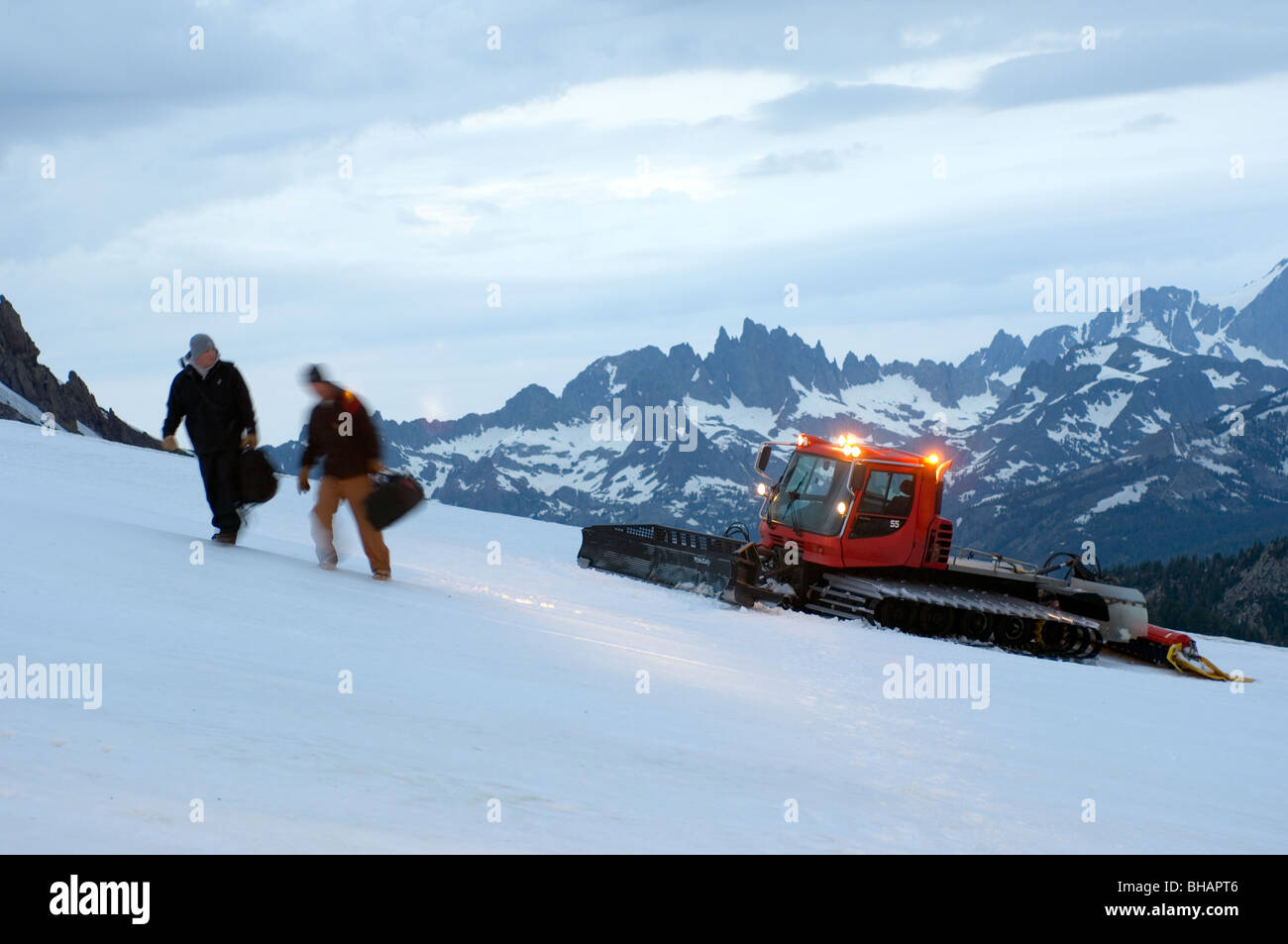 ski resort workers working around a snow grooming machine Stock Photo ...