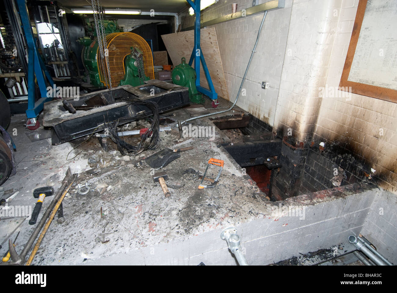 Fire in lift motor room showing burnt joists and motors Stock Photo - Alamy