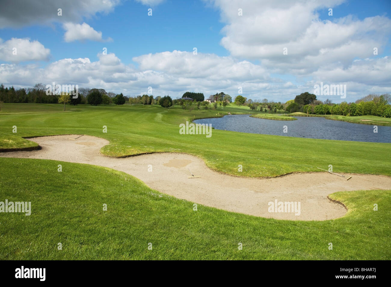 Sand trap and water trap on golf course Stock Photo - Alamy