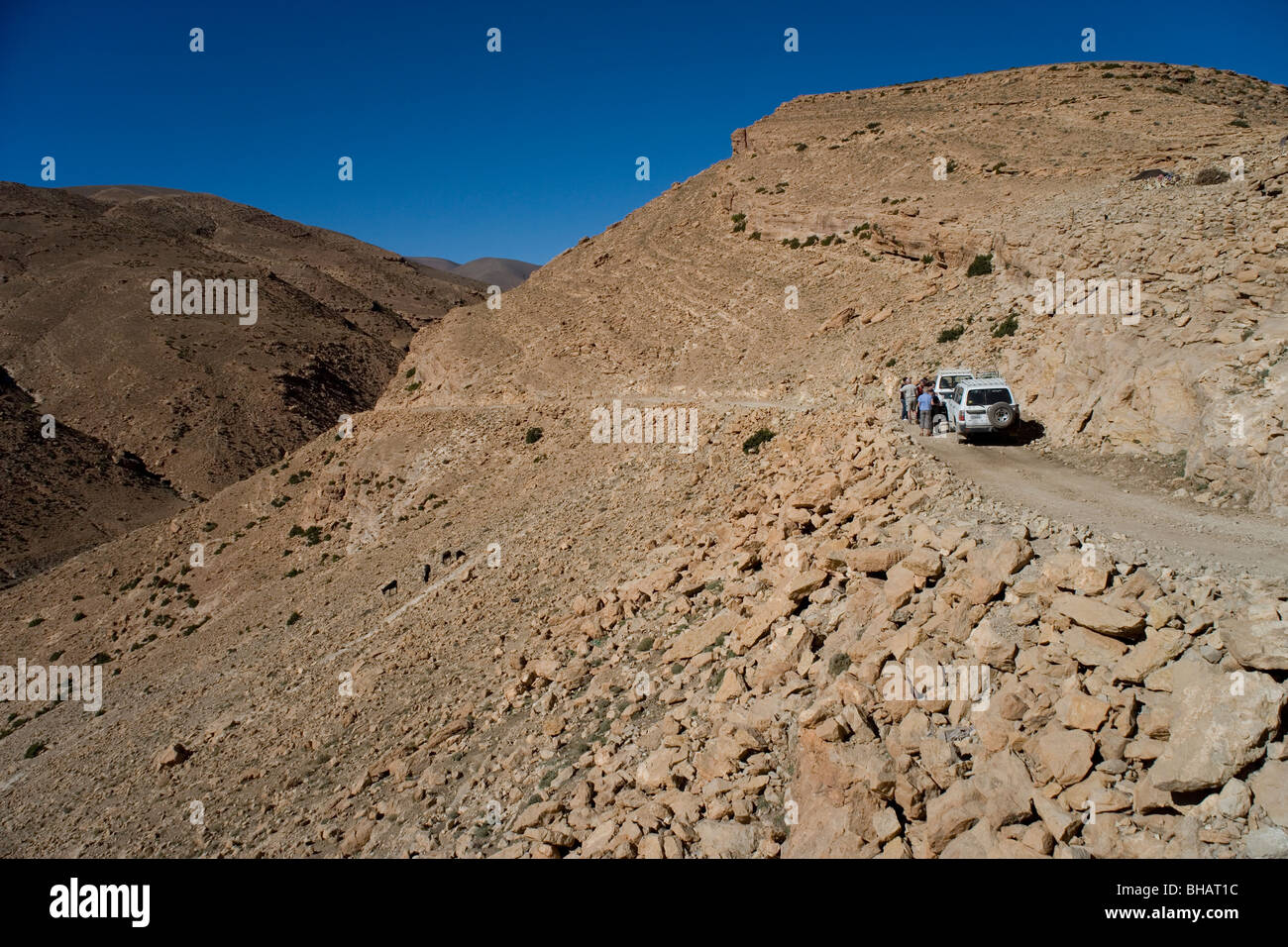 Car on a Dirt track road in the Atlas Mountains in the upper part of ...