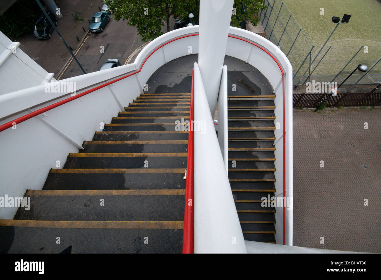 Stairway to Poplar DLR station and footbridge across road. White ...