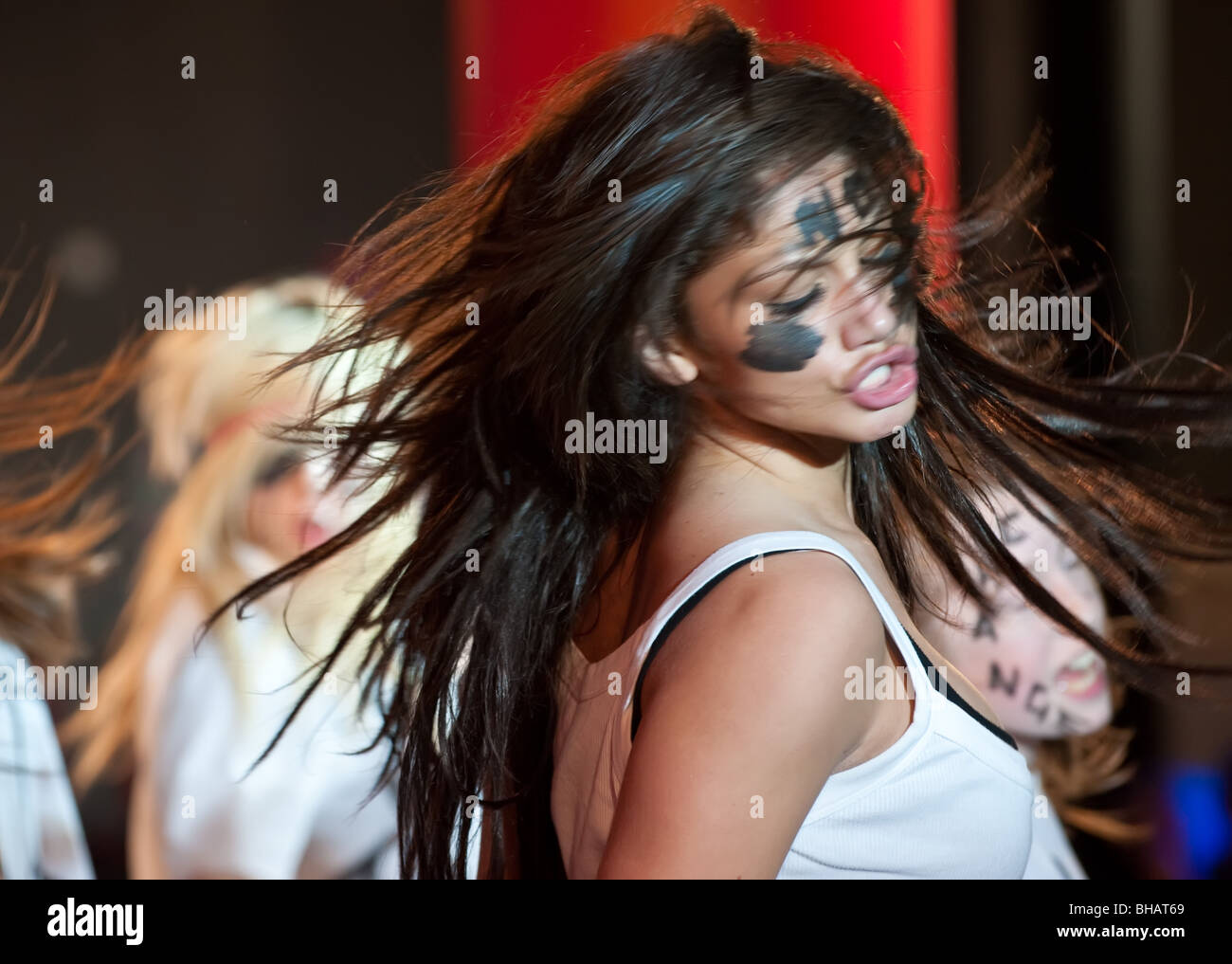 Young woman with a "NO" painted on her forehead dancing Stock Photo - Alamy