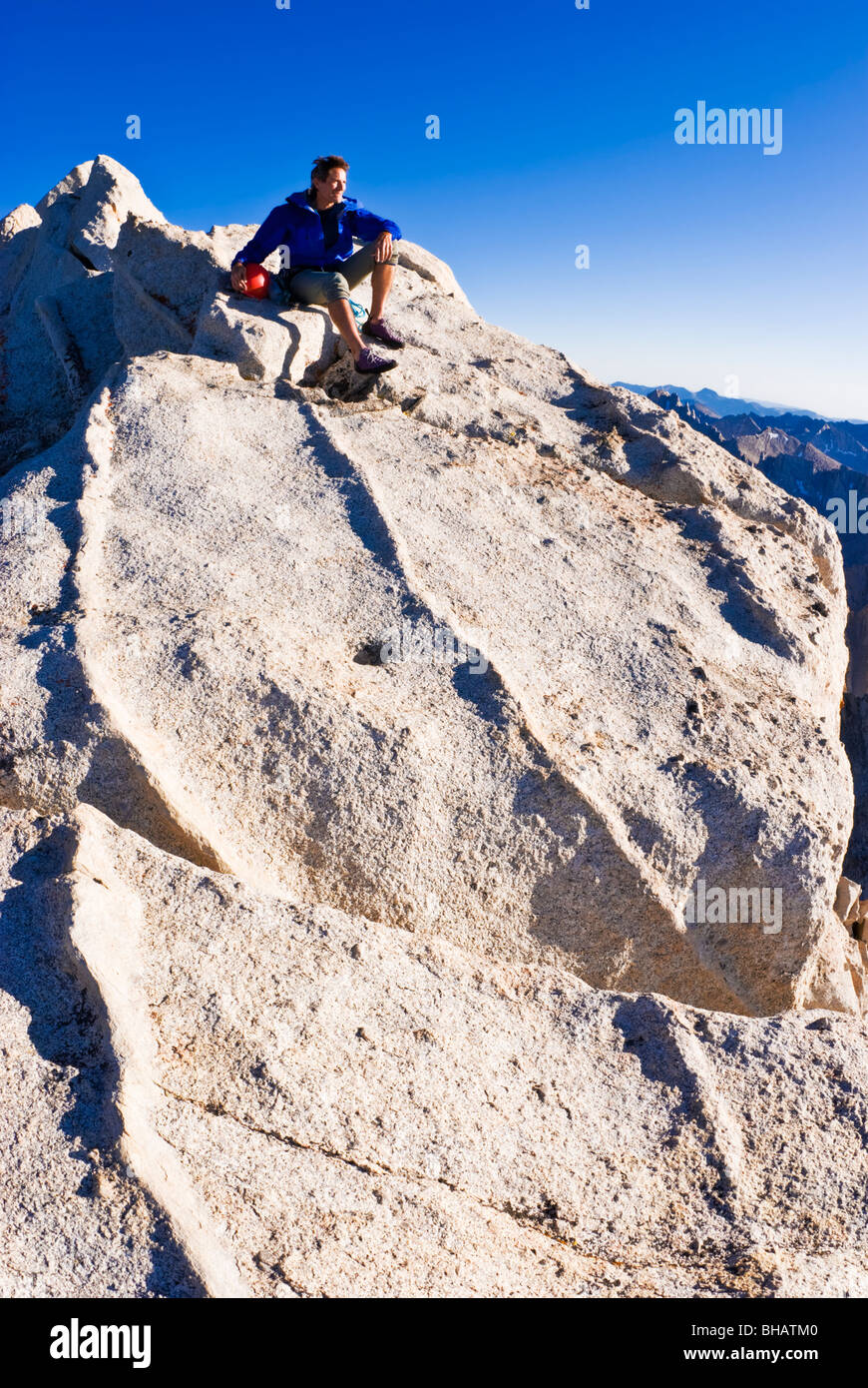 Climber on the summit of Bear Creek Spire, John Muir Wilderness, Sierra ...