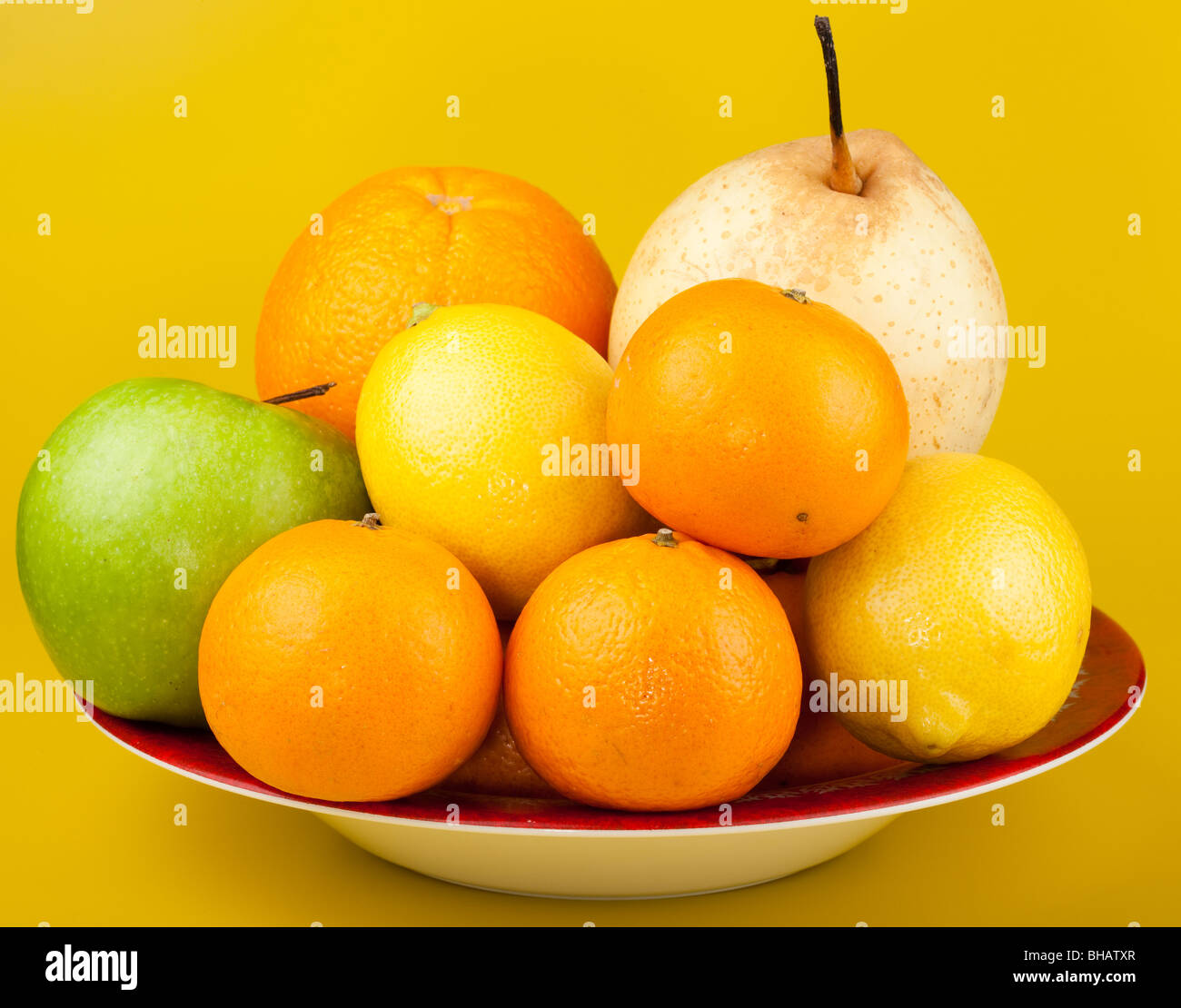 Fruit photographed on a yellow background with a gradient Stock Photo ...
