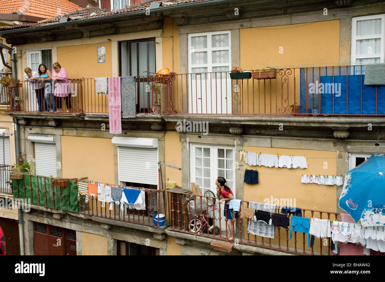Neighbours talking to each other on balconies Porto Portugal Europe ...