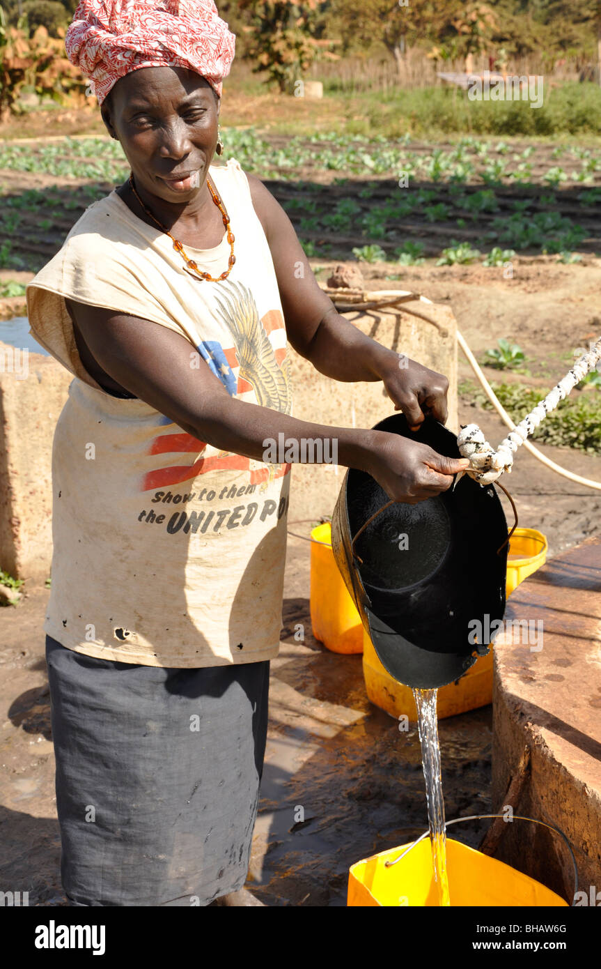 Woman fetching water hi-res stock photography and images - Alamy
