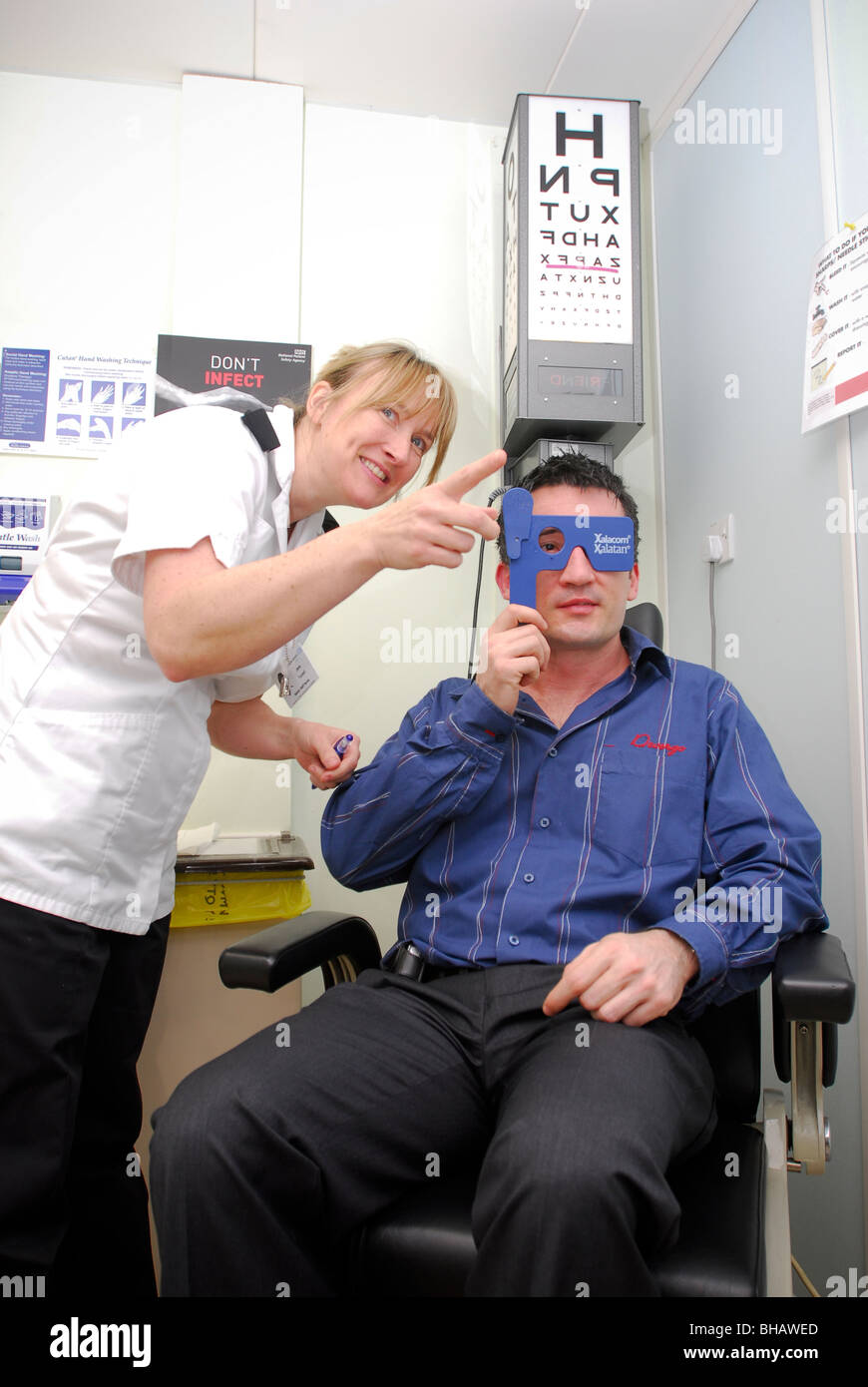 A nurse gives a patient an eye test in hospital UK Stock Photo - Alamy