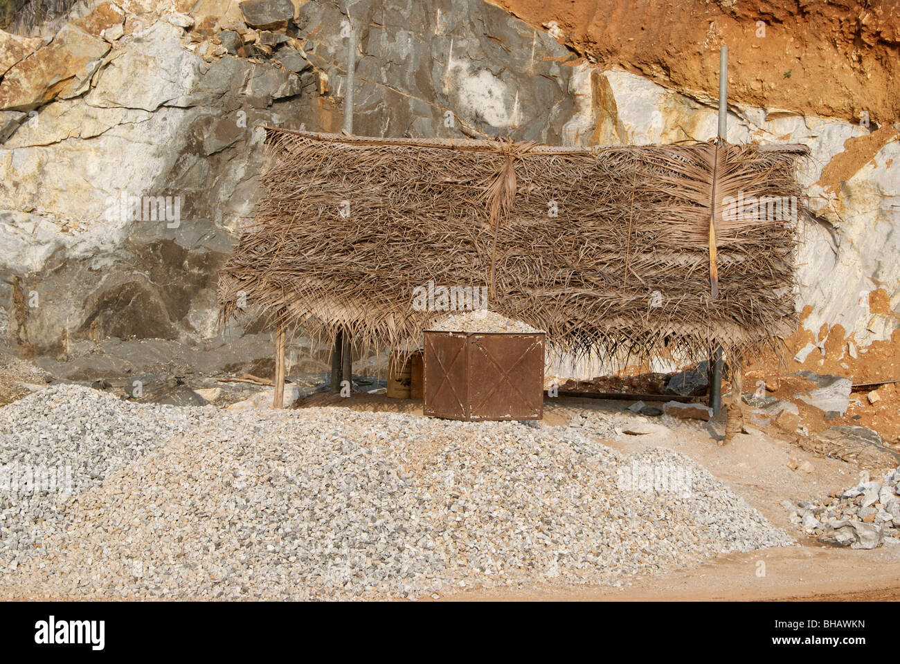 A small hut for stone storage and stone breaking in rock quarry Stock ...