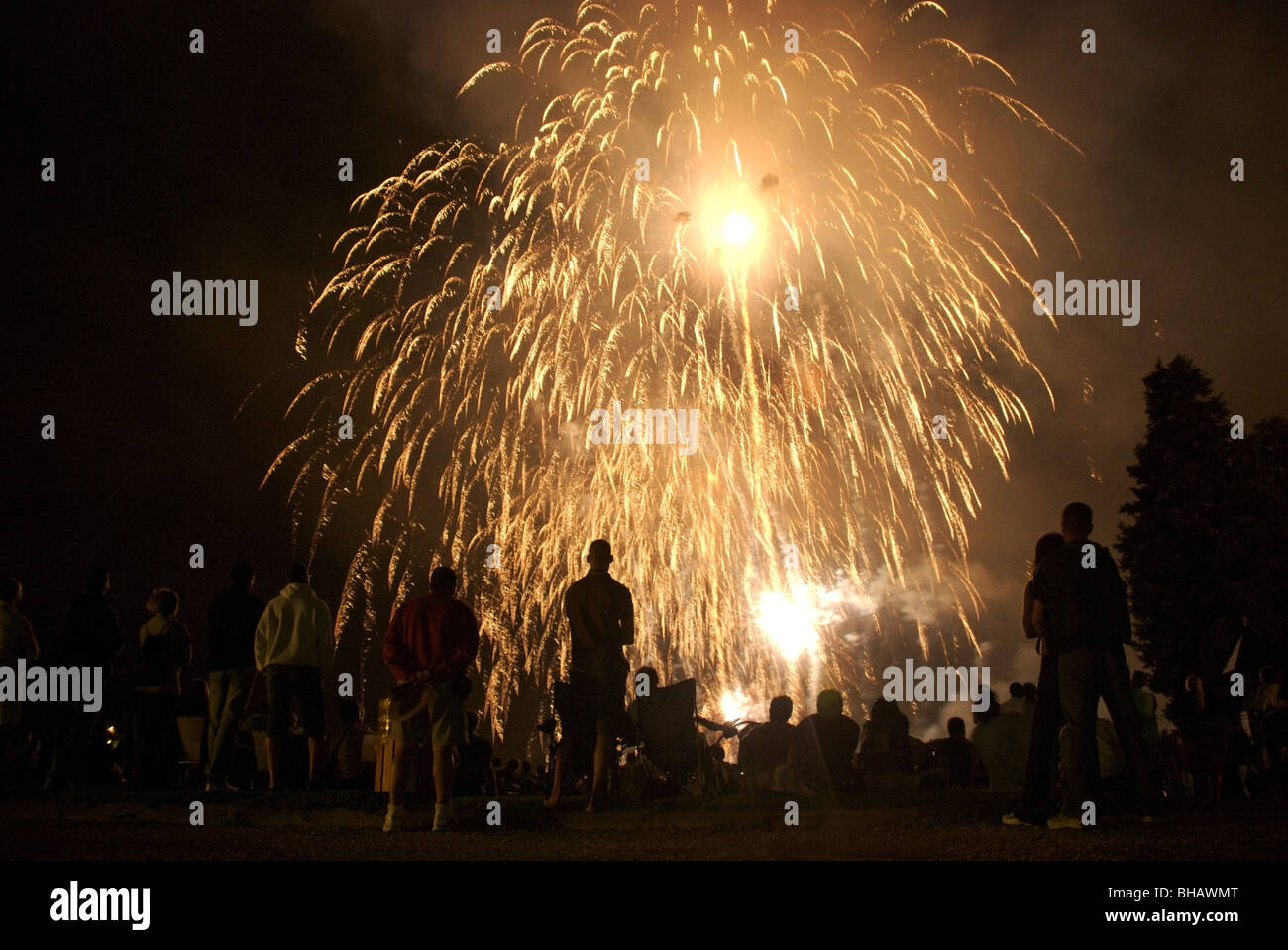 People watching fireworks display Stock Photo - Alamy