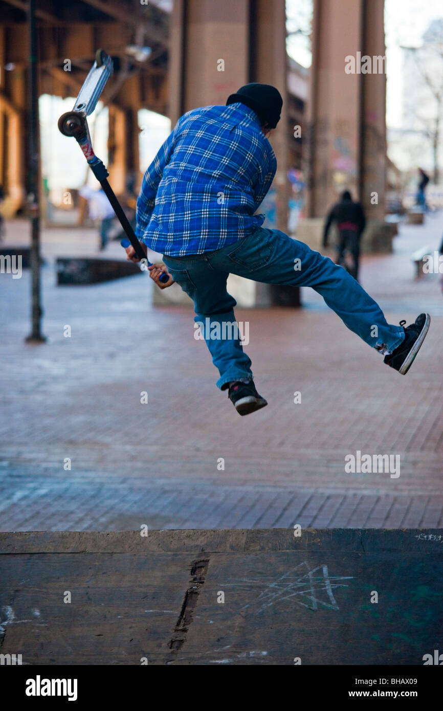 Teen doing razor scooter tricks in Manhattan, New York City Stock Photo ...