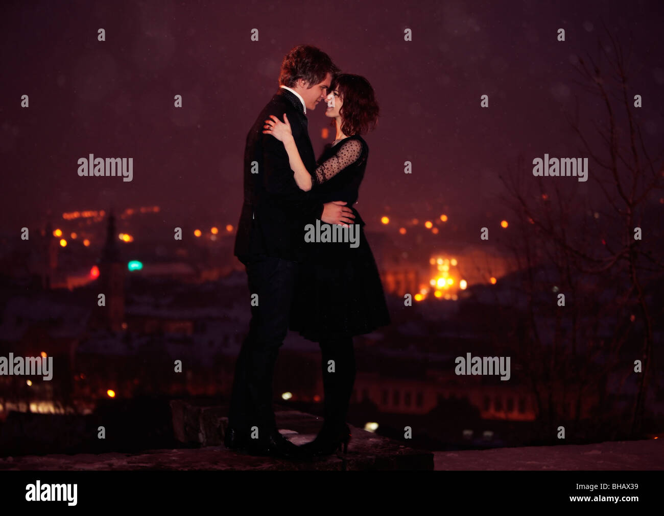 Full length profile of Romantic Couple looking into each others eyes ...