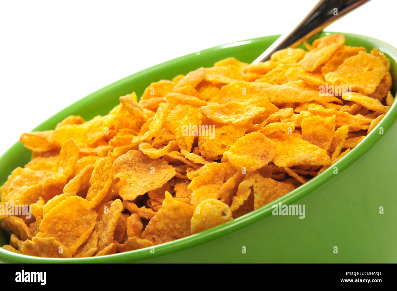 Cornflakes in the green bowl isolated on the white background Stock ...