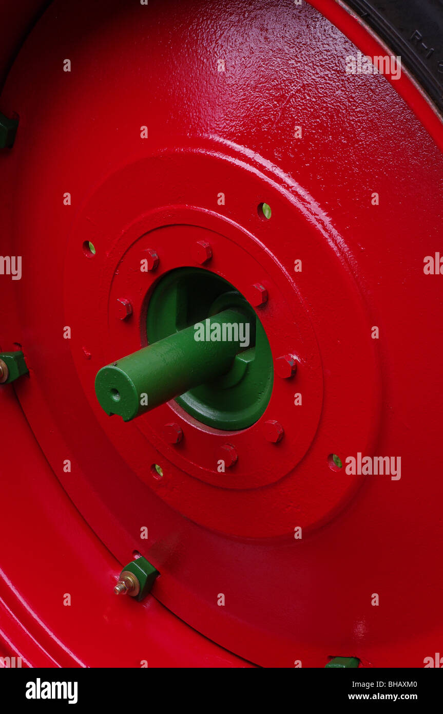 Read rear wheel of a restored farm tractor Stock Photo - Alamy