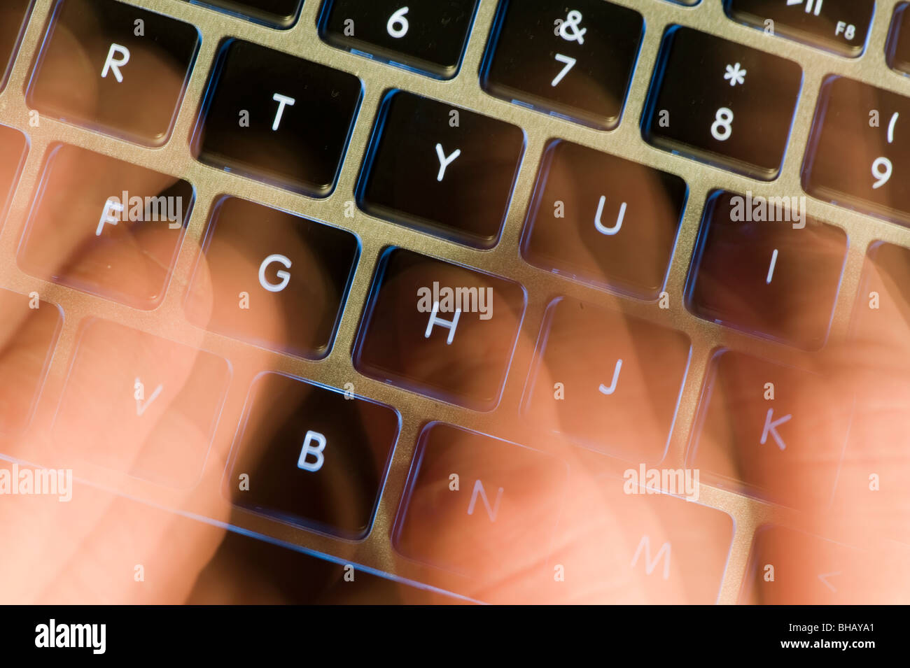 Moving fingers across laptop keyboard Stock Photo - Alamy