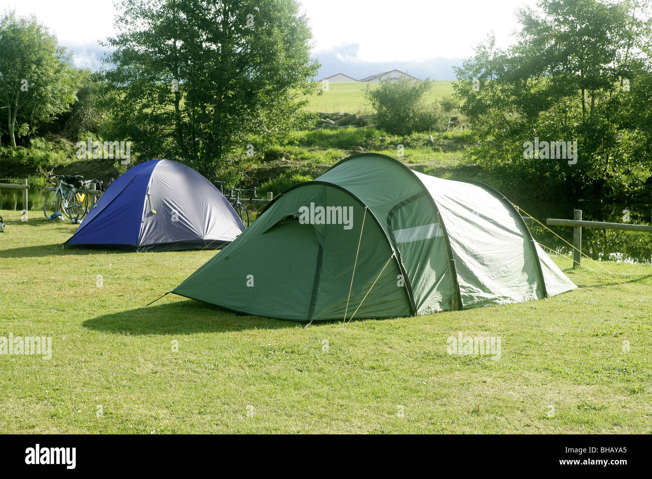 Camping tent field over green grass outdoor field Stock Photo - Alamy
