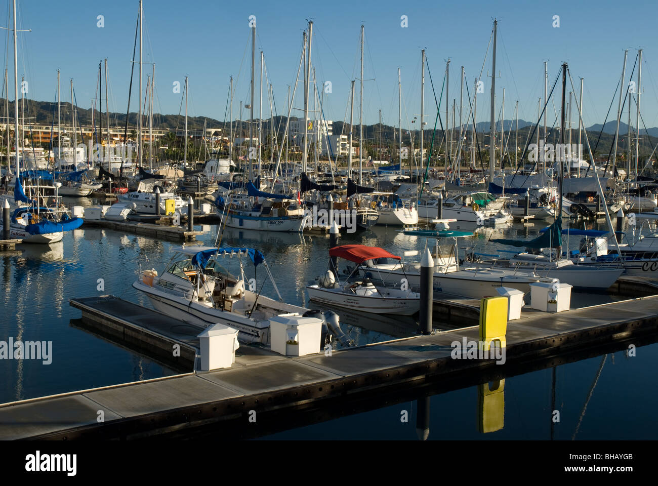 Power boats and sailing vessels in slips at La Cruz Marina, Mexico ...