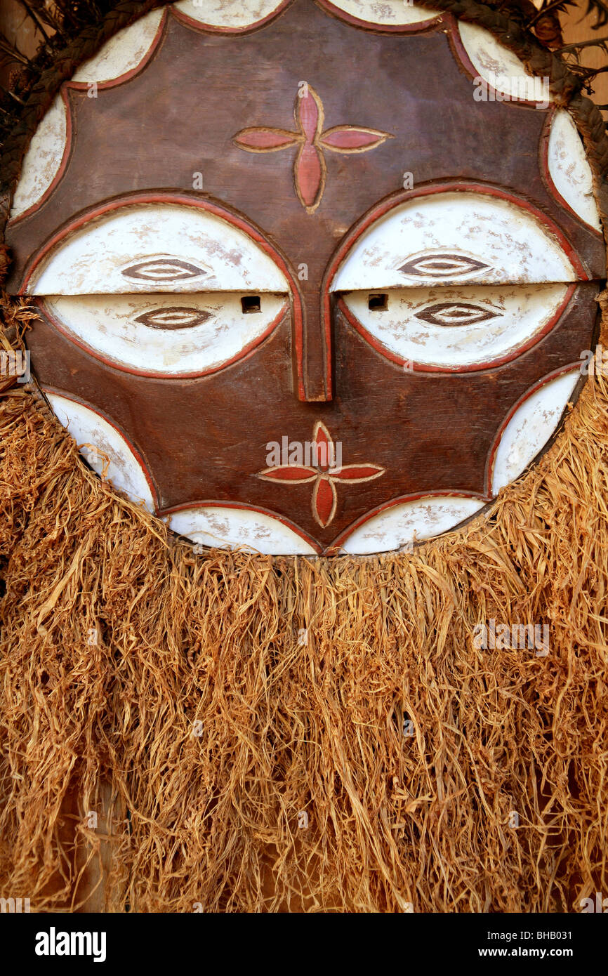 African ethnic wooden warrior shield round face paint Stock Photo - Alamy